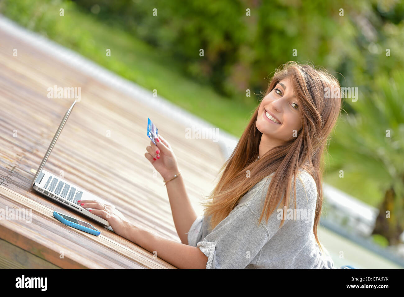 Young woman making purchases on Internet-Online banking Stock Photo - Alamy