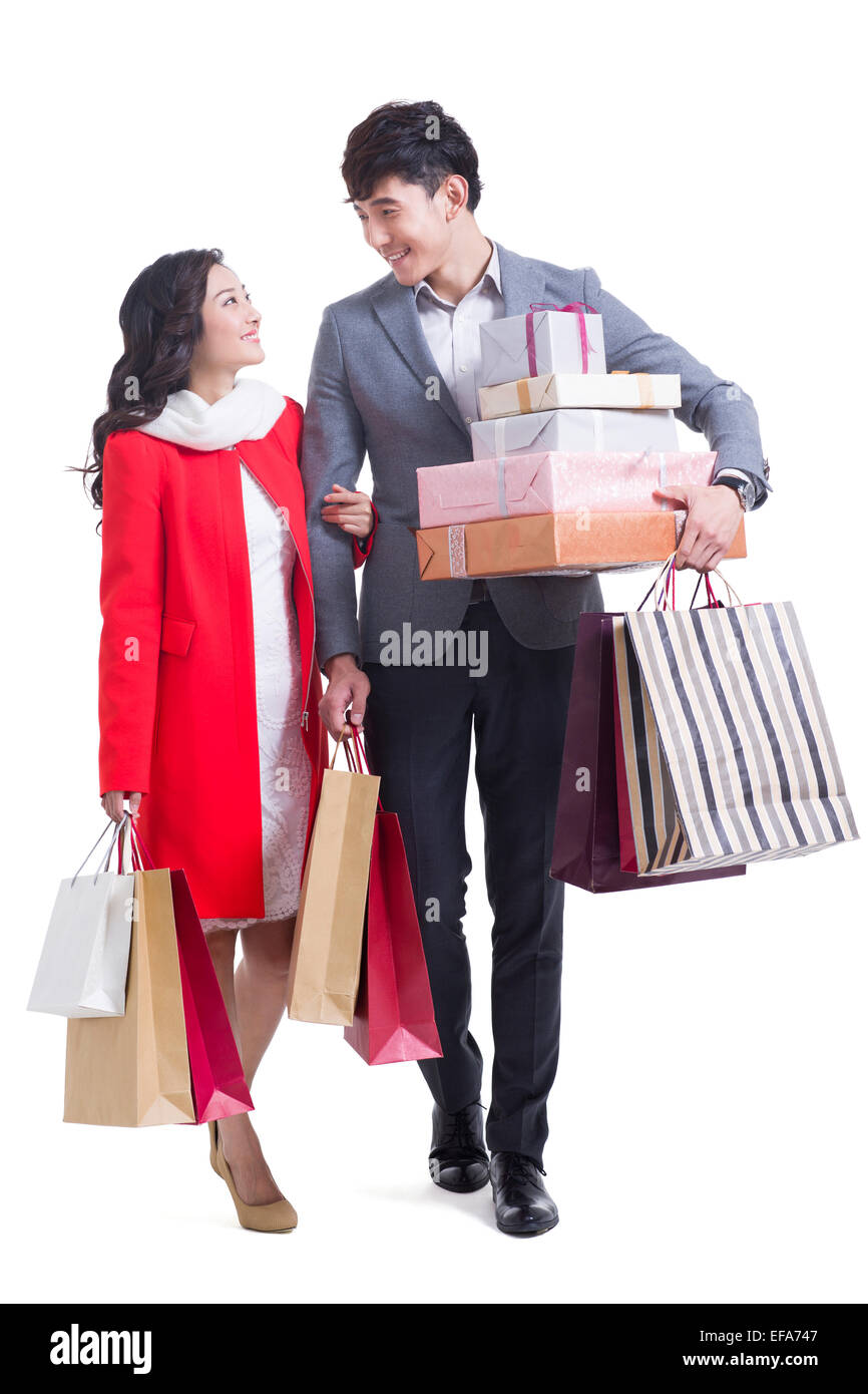 Happy young couple going shopping Stock Photo - Alamy