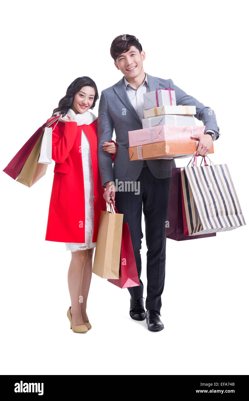 Happy young couple going shopping Stock Photo - Alamy