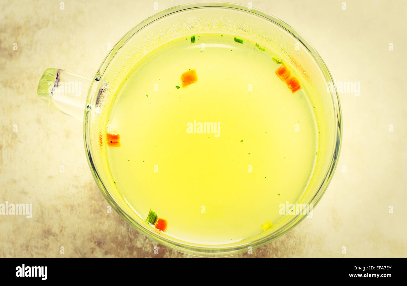 Broth in a transparent cup top view Stock Photo - Alamy