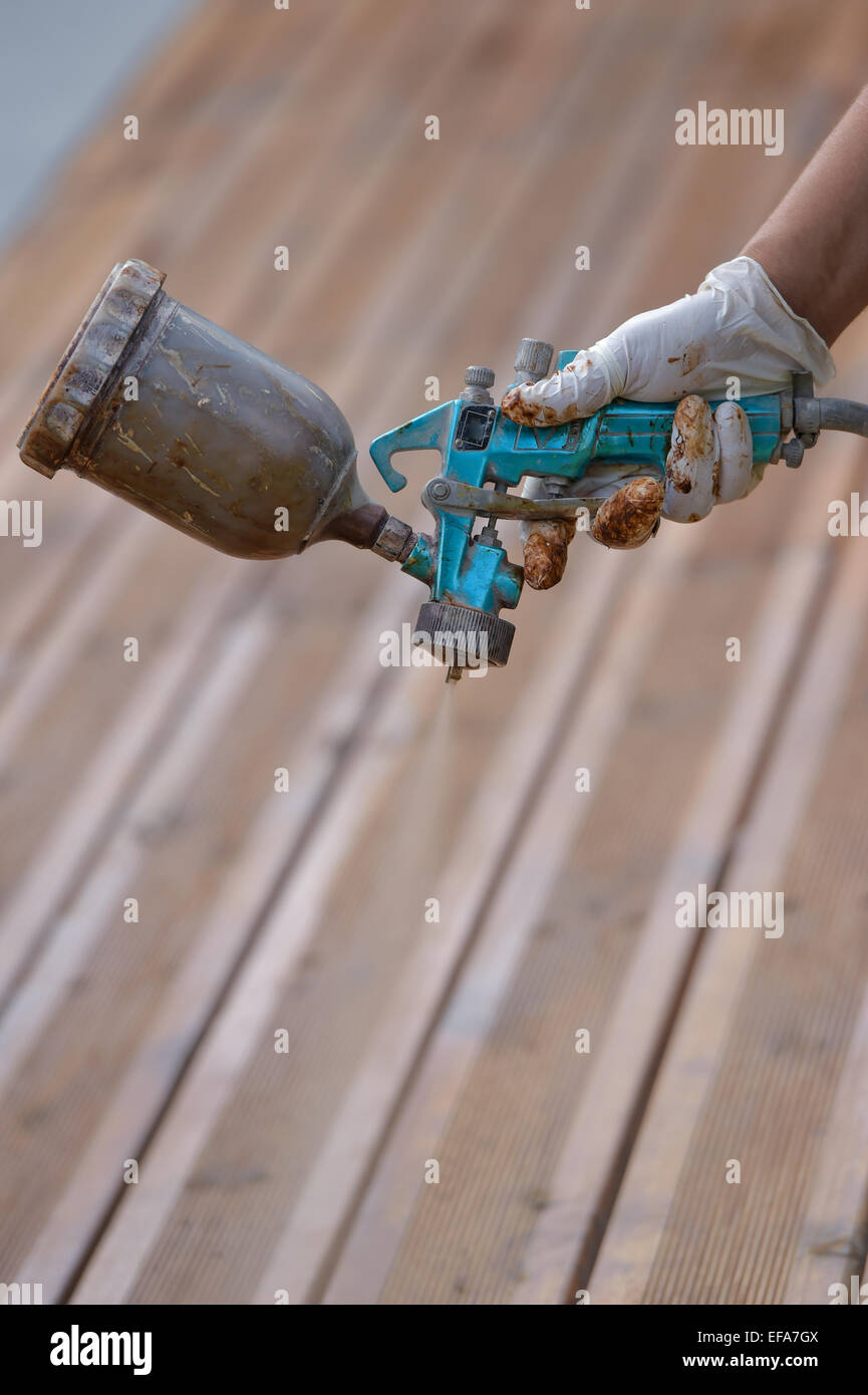 Holding paint spray gun hi-res stock photography and images - Alamy