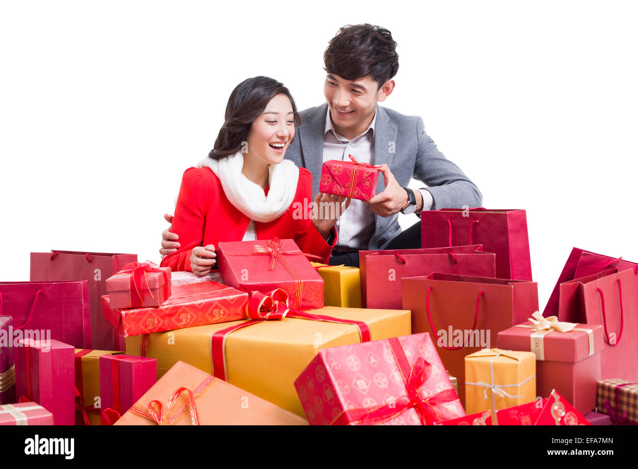 Happy young couple with many gifts Stock Photo - Alamy