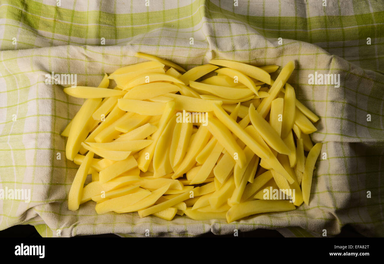 Raw potato cut into french fries Stock Photo - Alamy