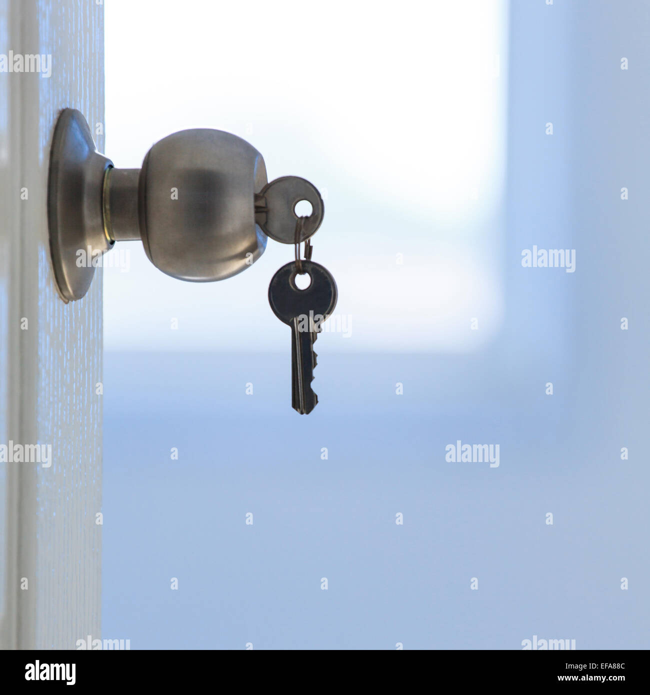 Open door with keys, key in keyhole Stock Photo - Alamy