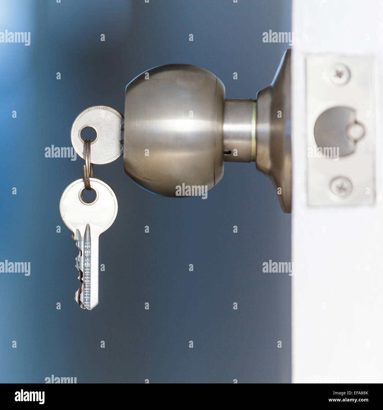 Open door with keys, key in keyhole Stock Photo - Alamy
