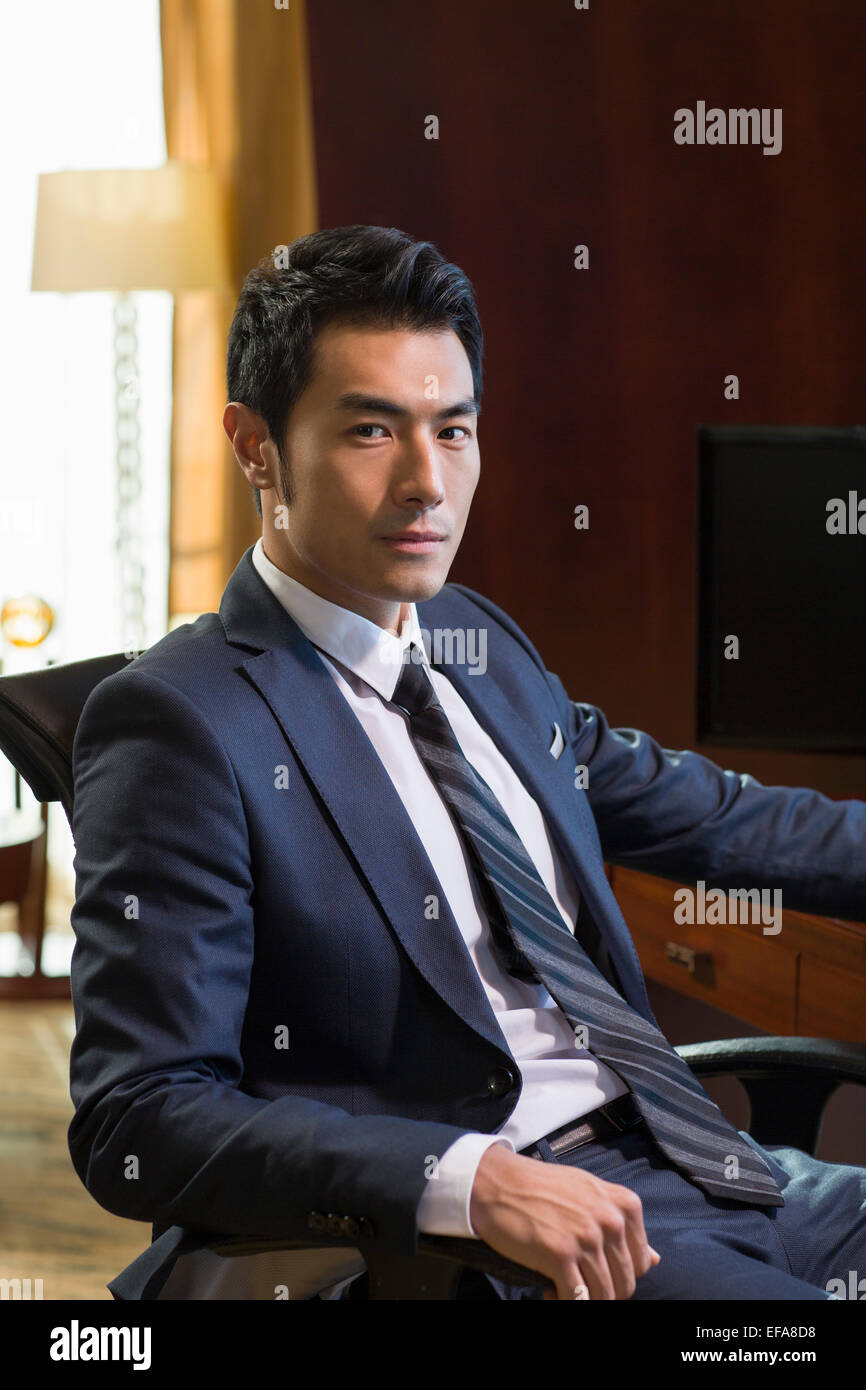 Portrait of successful businessman in study Stock Photo - Alamy