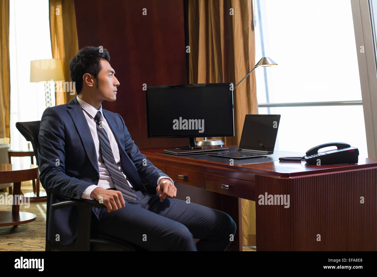 Successful businessman thinking in study Stock Photo - Alamy