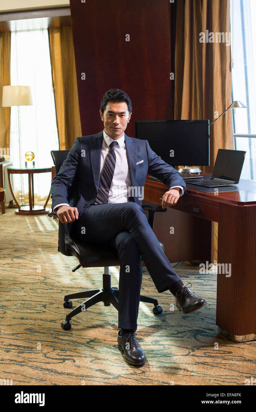 Portrait of successful businessman in study Stock Photo - Alamy