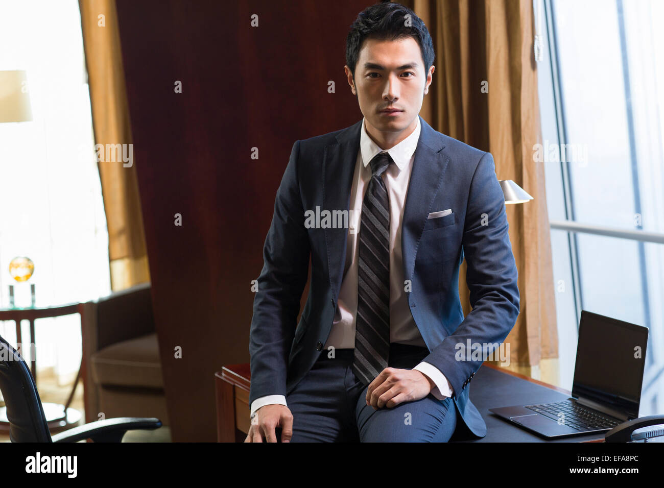 Portrait of successful businessman in study Stock Photo - Alamy
