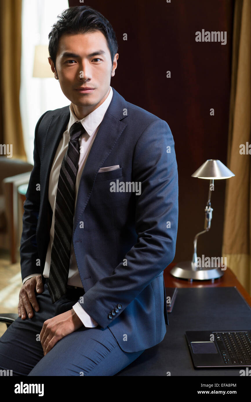 Portrait of successful businessman in study Stock Photo - Alamy