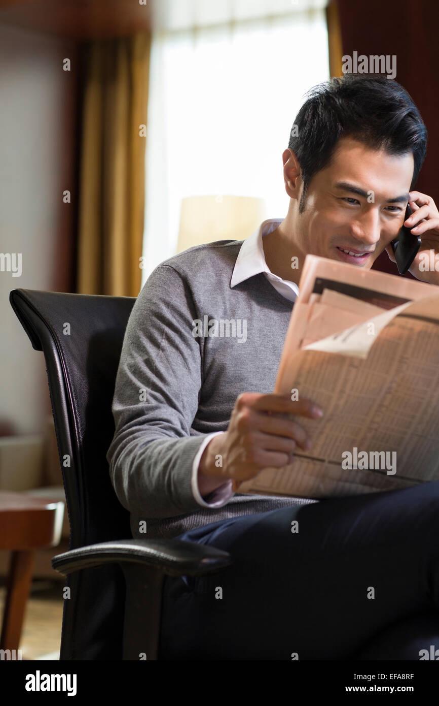Chinese people reading newspaper in beijing hi-res stock photography ...