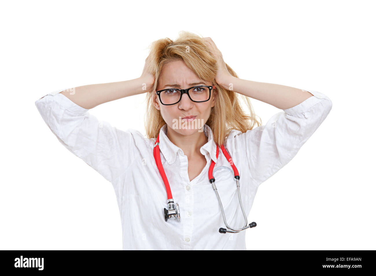 Female doctor realizing she made a mistake with her hands in her hair ...