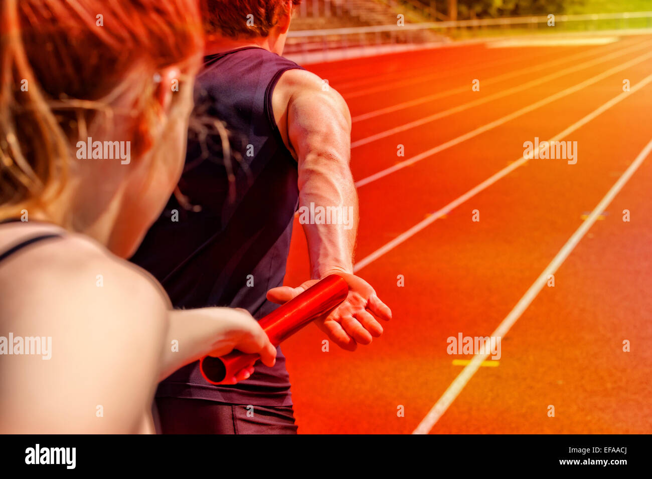 Relay race handing over hi-res stock photography and images - Alamy