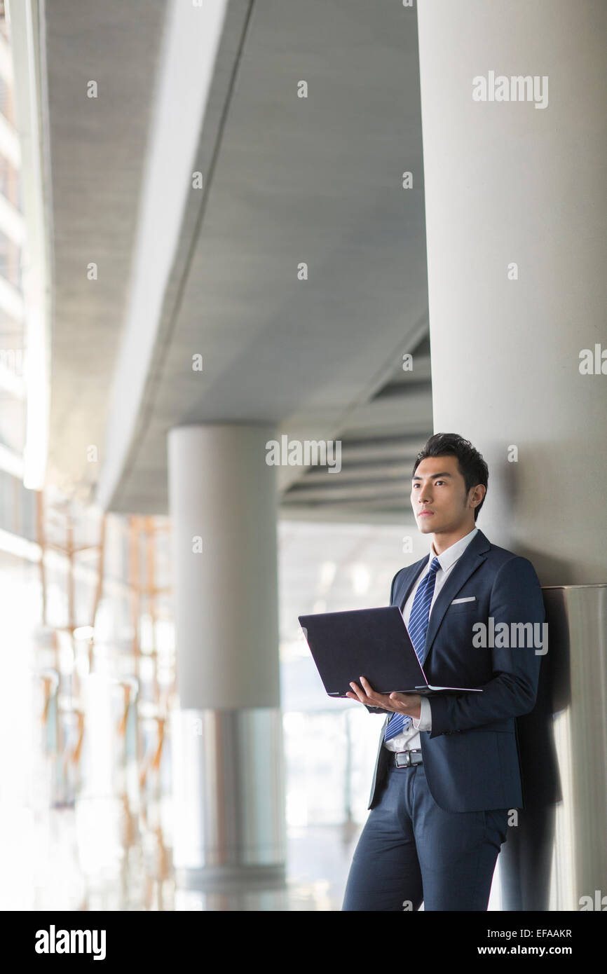 Young businessman using laptop Stock Photo - Alamy Young businessman using laptop Stock Photo - Alamy