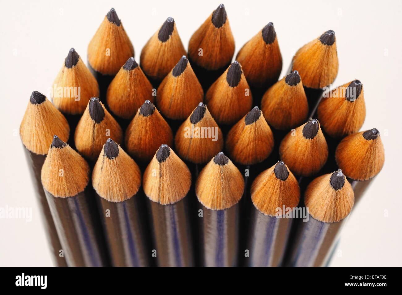 Black pencils showing the newly sharpened tips Stock Photo - Alamy