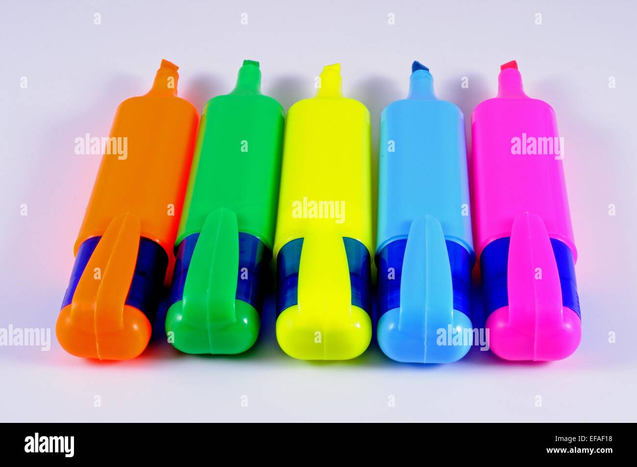 Highlighter pens with caps removed against a white background Stock ...