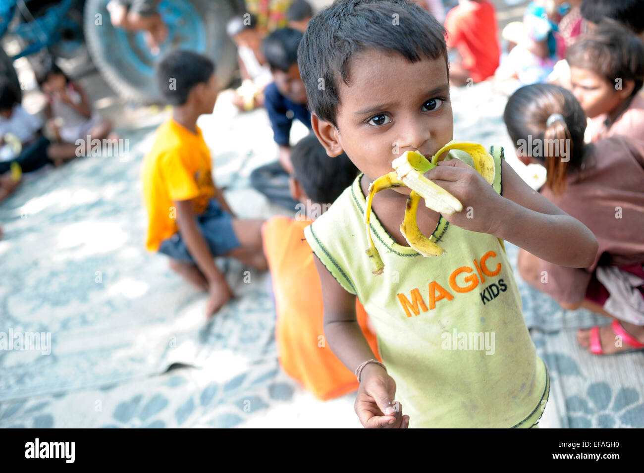 indian child eating fruit during break from class mobile school bus ...