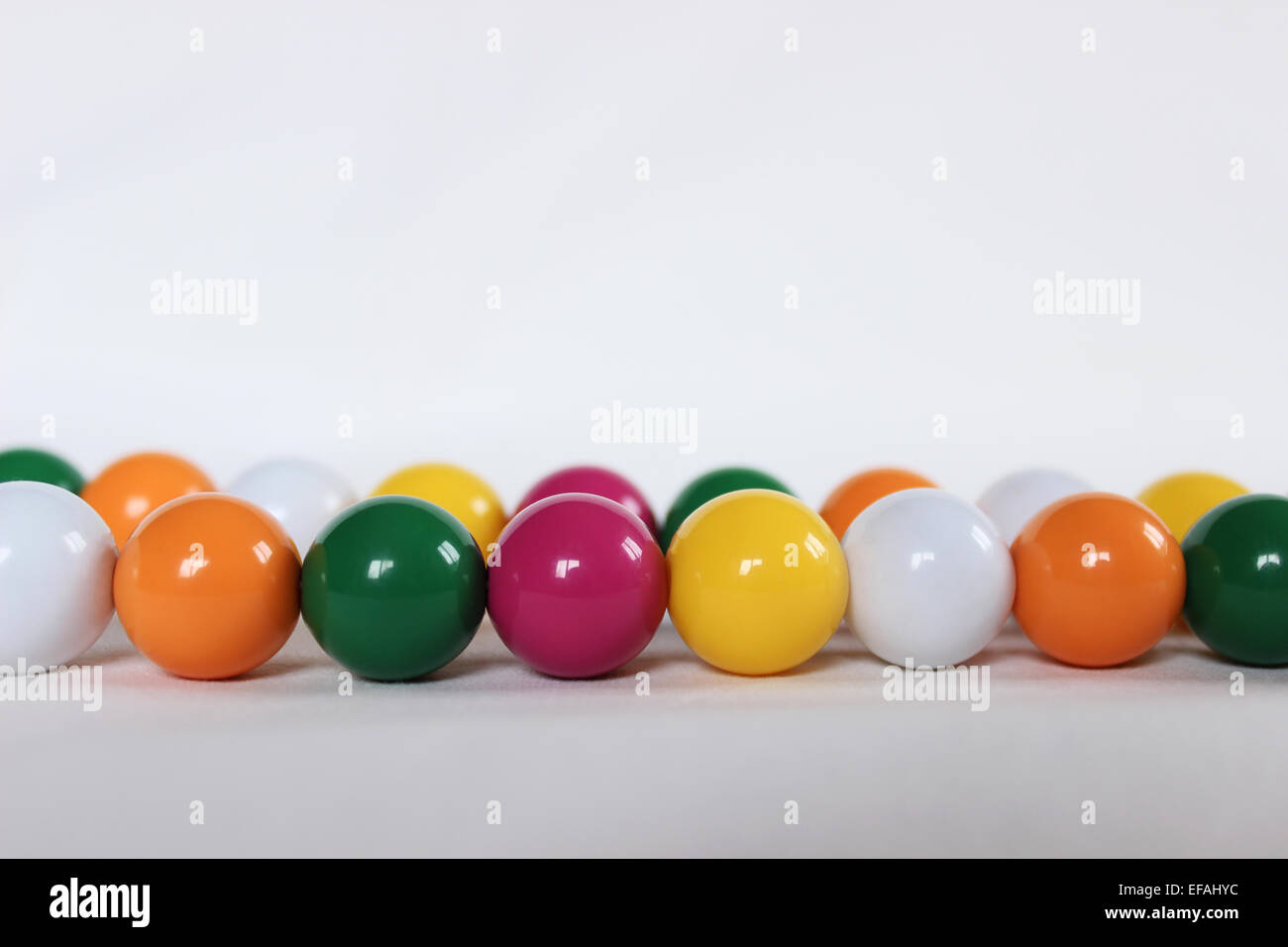 Colored balls on white background Stock Photo - Alamy