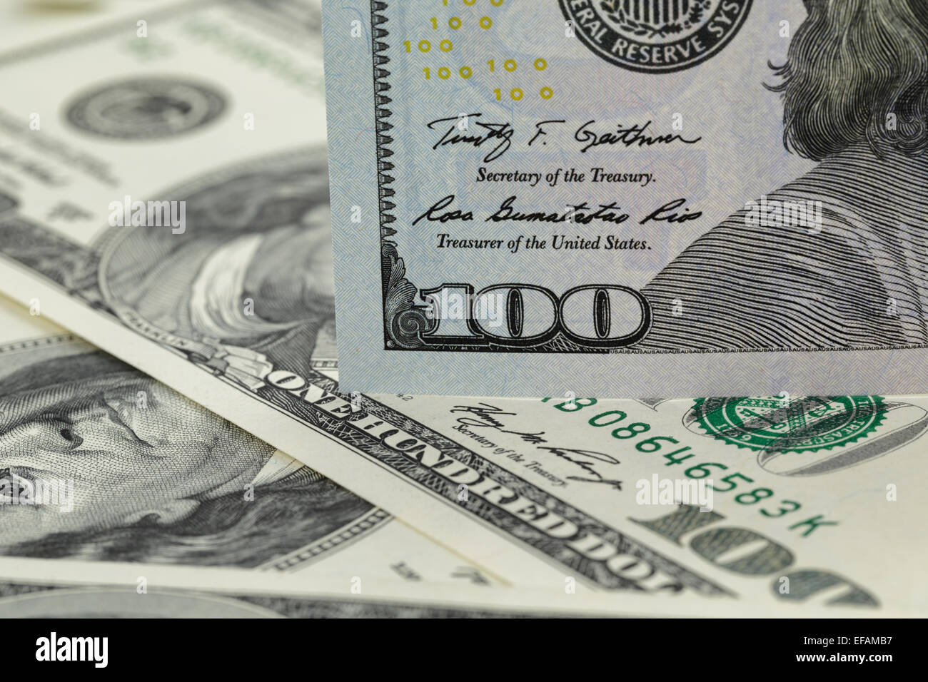 new one hundred dollar note on heap of old notes Stock Photo - Alamy
