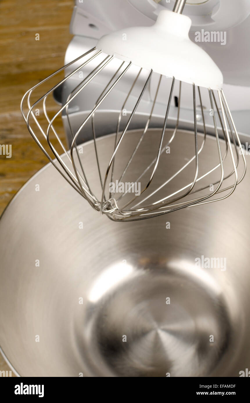 Whisk tool above the bowl of a food processor Stock Photo - Alamy