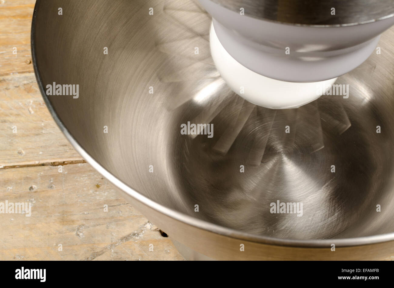 Whisk tool of a food processor rotating inside the bowl Stock Photo - Alamy