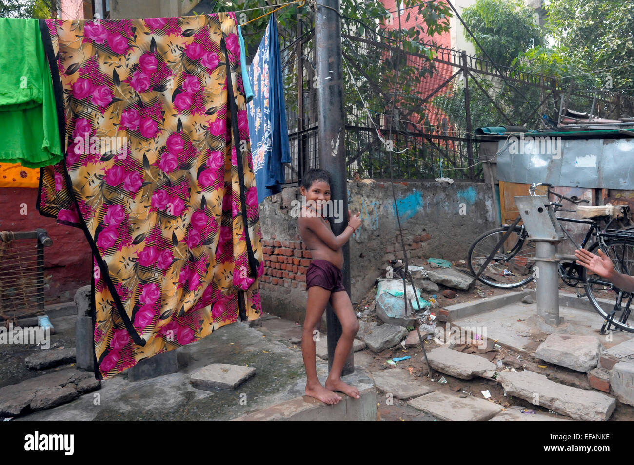 so called slum dweller india boy eyes to camera bright fabric india ...
