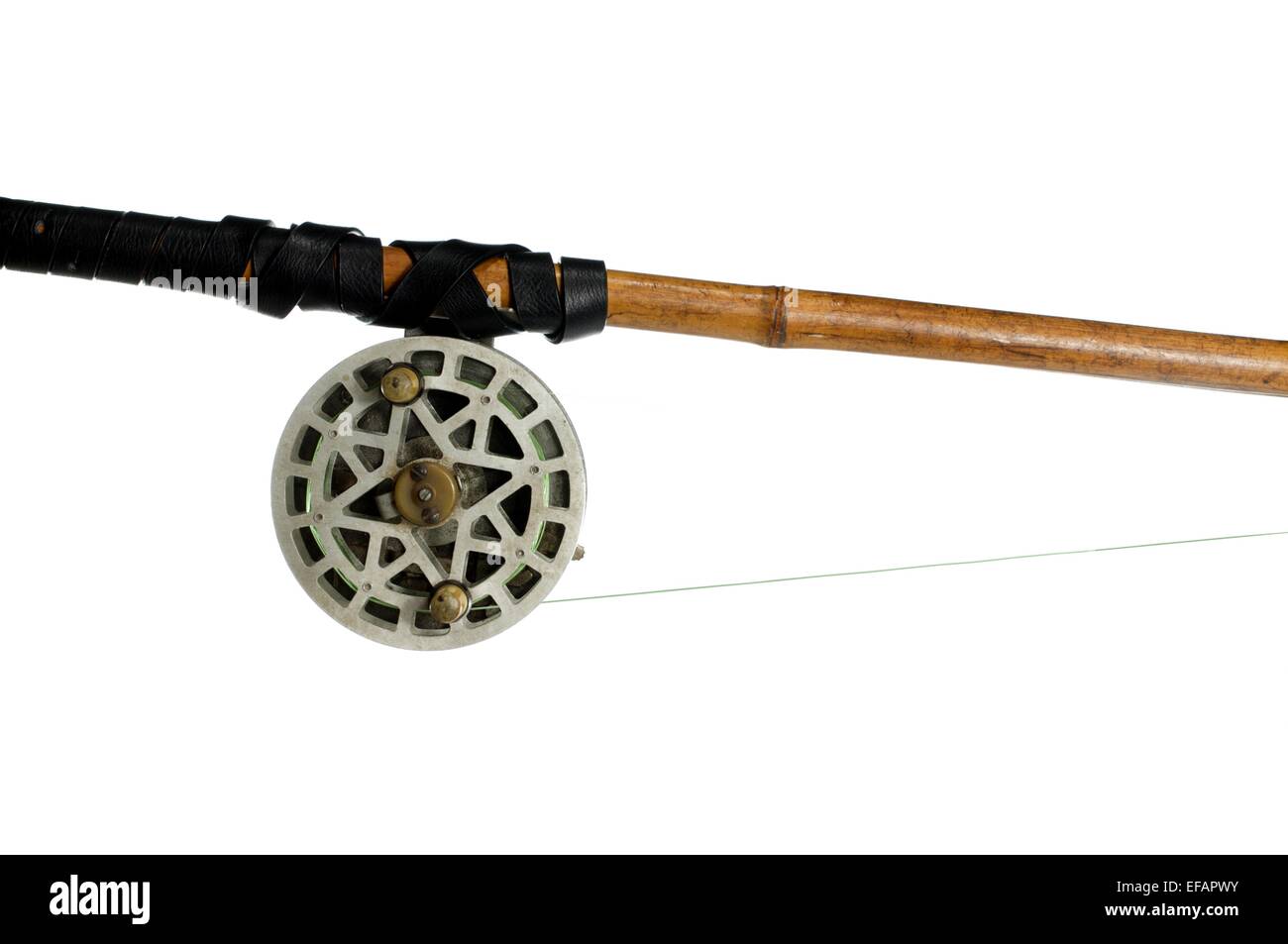 fishing-rod with old spinning-wheel on white background Stock Photo - Alamy