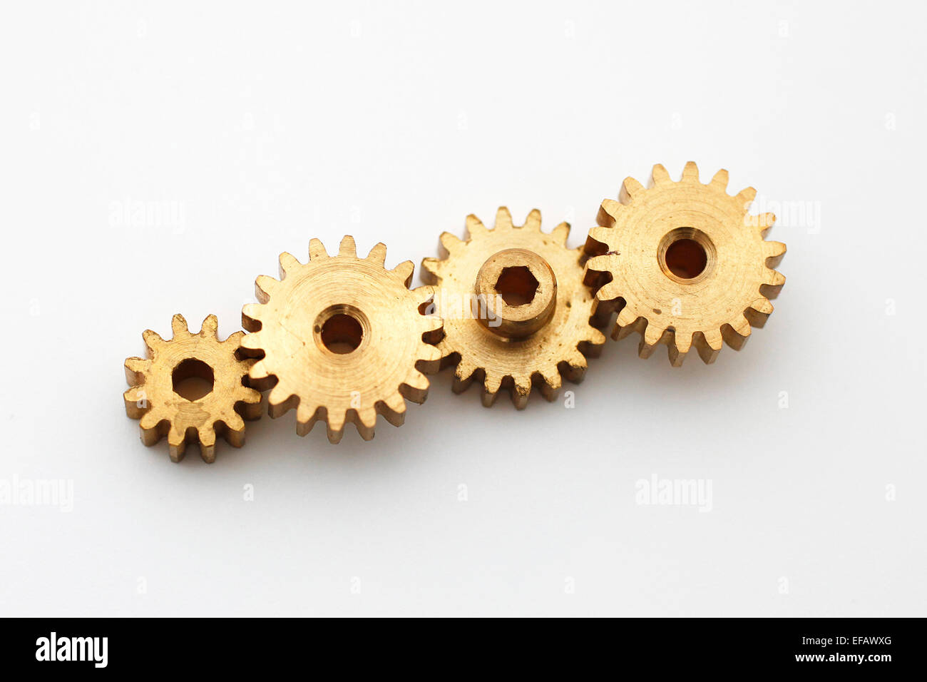 A Tabletop Composition Of A System Of Copper Gear Wheels On White ...