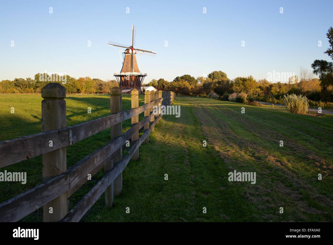 wooden fence leading to a windmill Stock Photo - Alamy