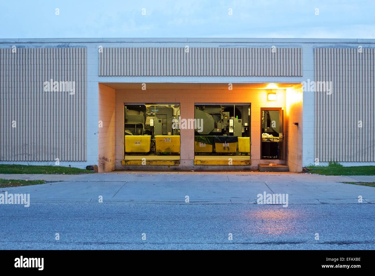 Open garage doors at an industrial laundromat loading dock Stock Photo ...