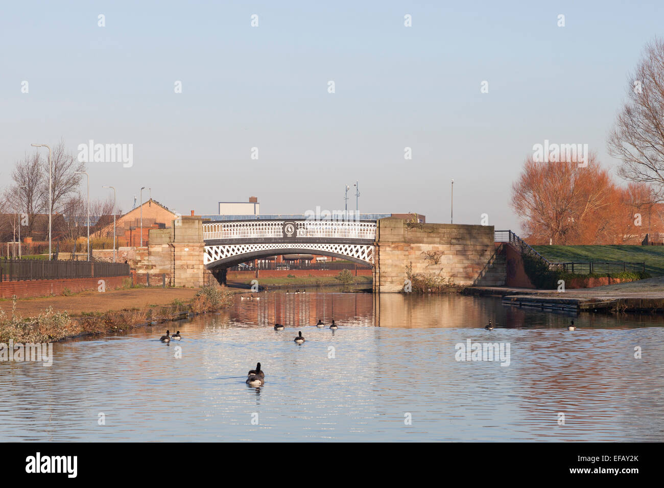 A bridge crosses the Leeds and Liverpool Canal near Stanley Dock in ...