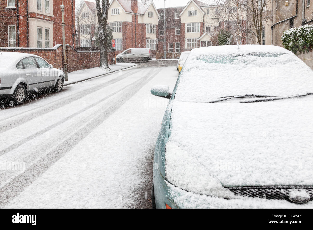 Snow falling on a side street, West Bridgford, Nottinghamshire, England ...