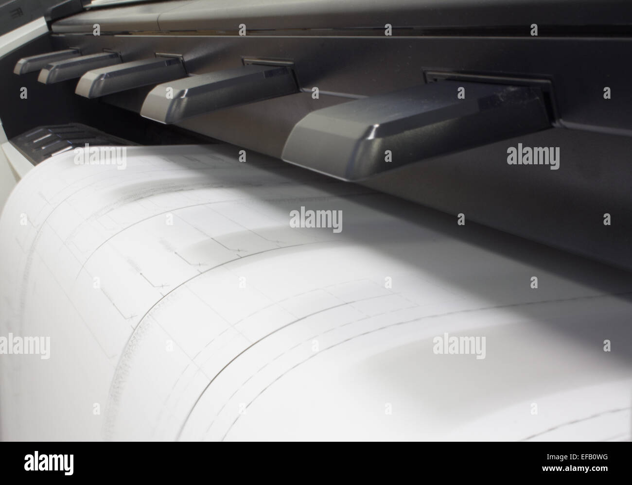 A CAD plotter printing a drawing shot from the right Stock Photo - Alamy