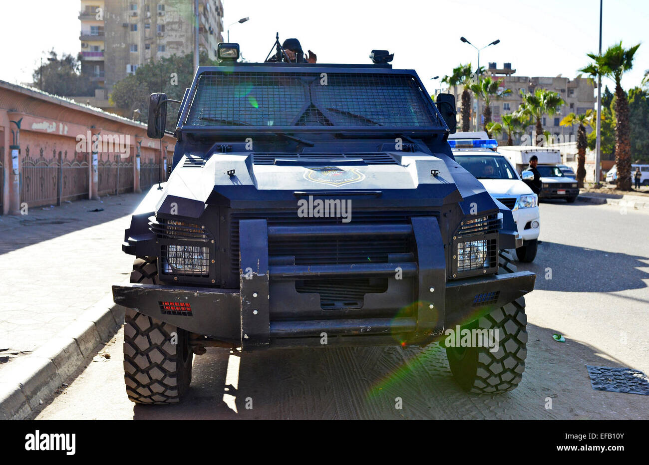 Cairo, Egypt. 30th Jan, 2015. Egyptian security forces sit on a ...