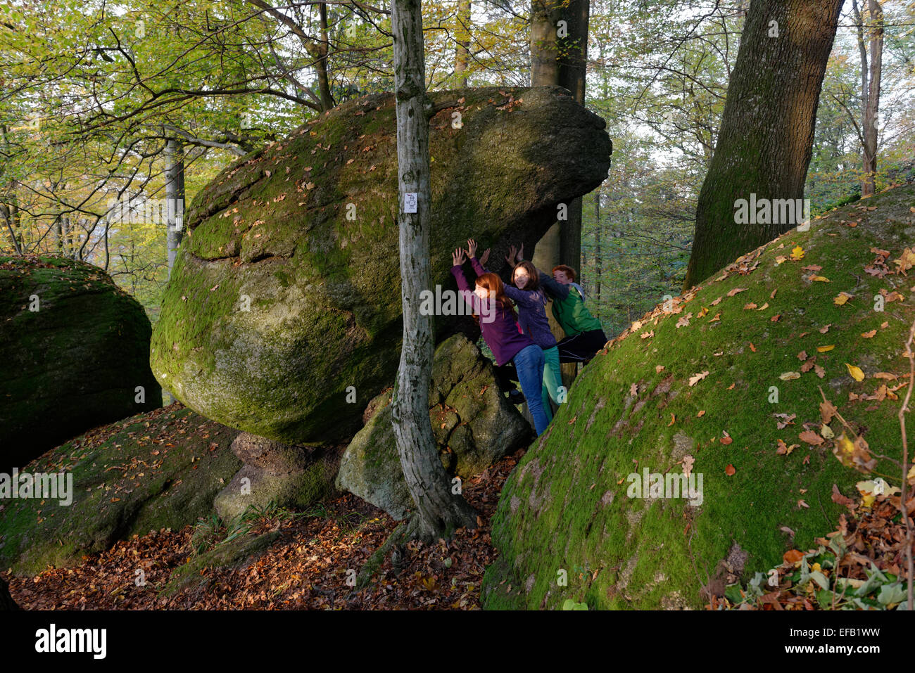 Family hiking in a rock park, rocks, rock garden, concentric weathering ...