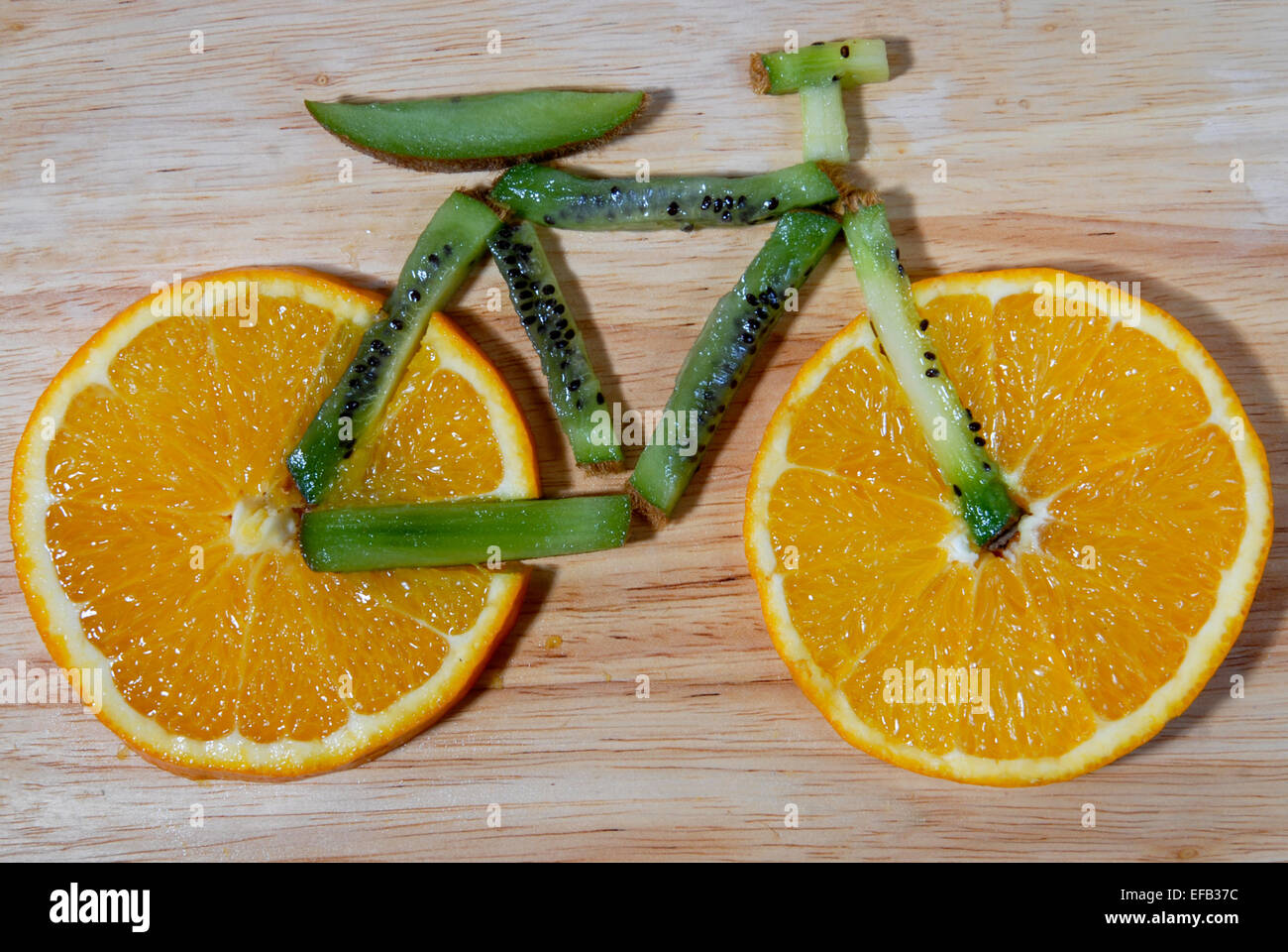 bike with fruits,orange and kiwi Stock Photo - Alamy