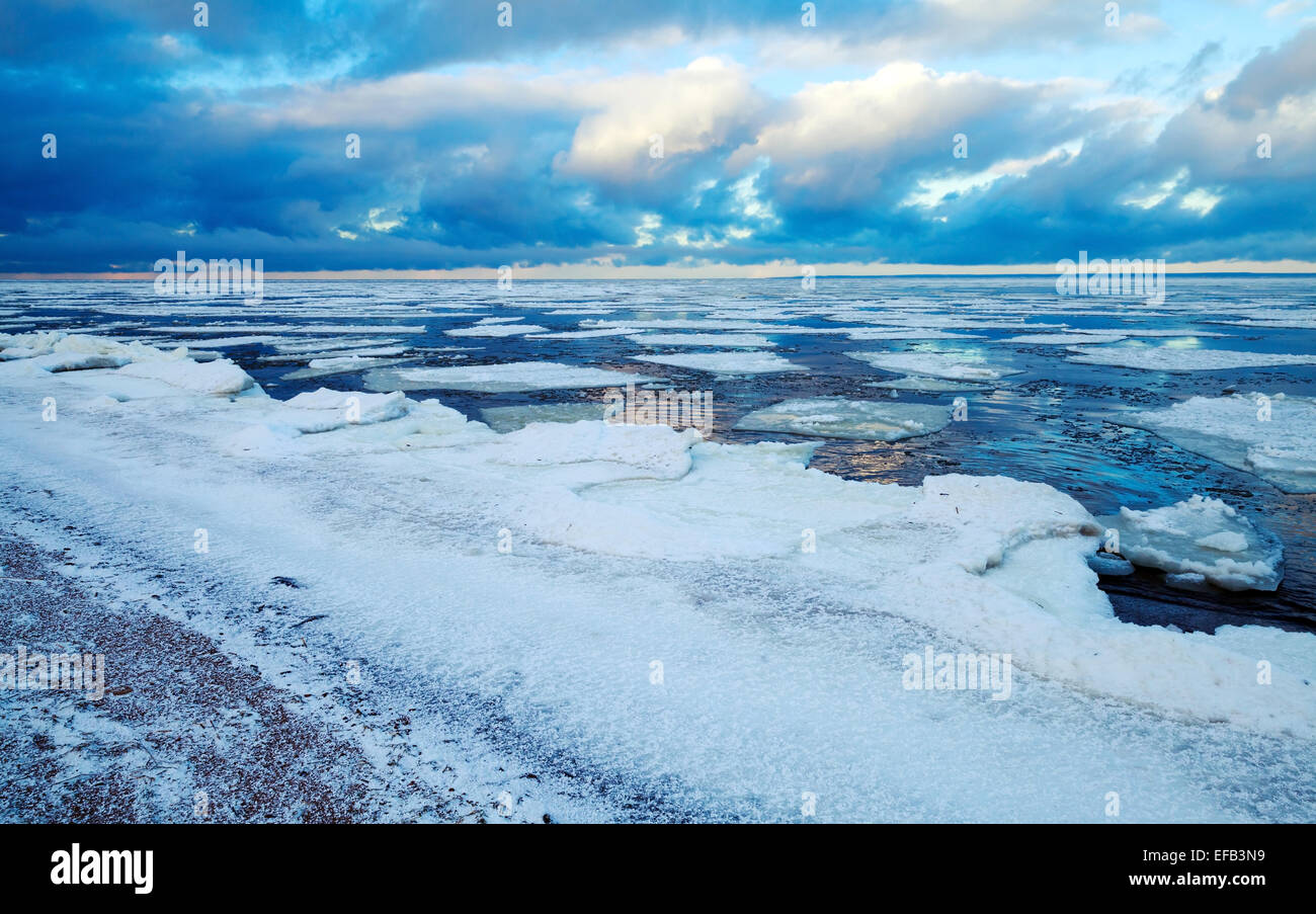 Winter coastal landscape with floating ice fragments on sea water. Gulf ...