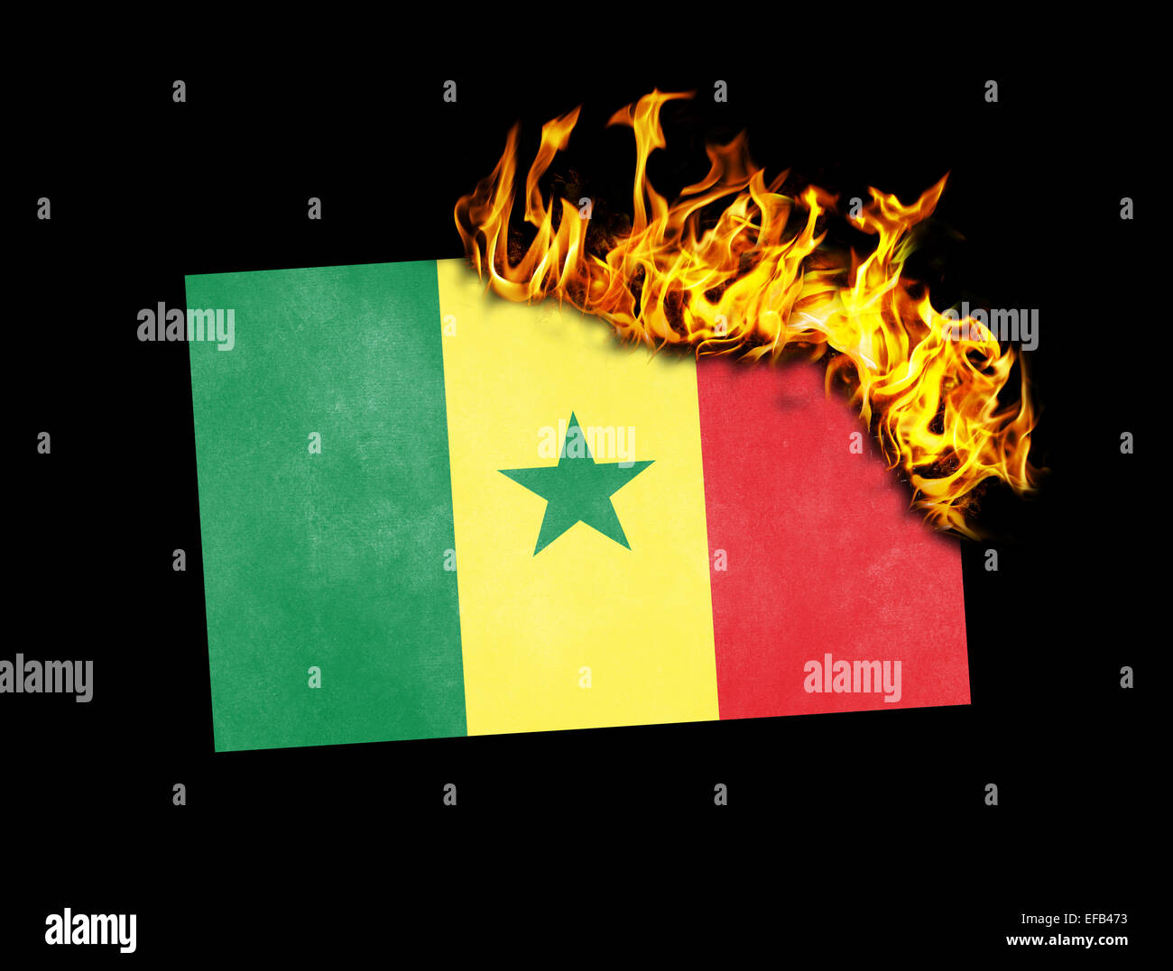 Flag burning - concept of war or crisis - Senegal Stock Photo - Alamy