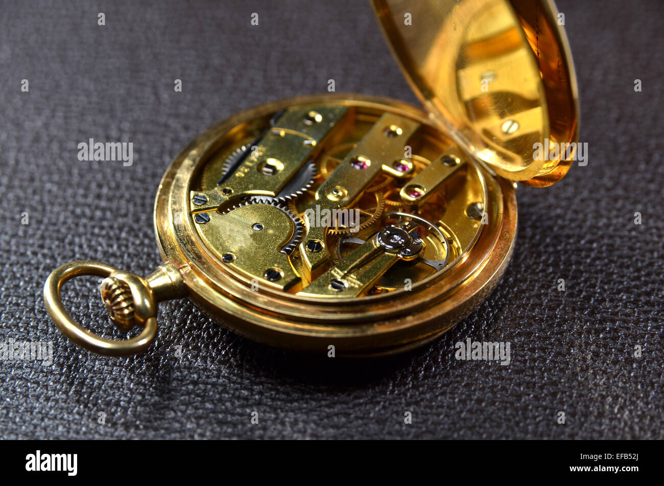 Golden pocket watch mechanism close up Stock Photo - Alamy