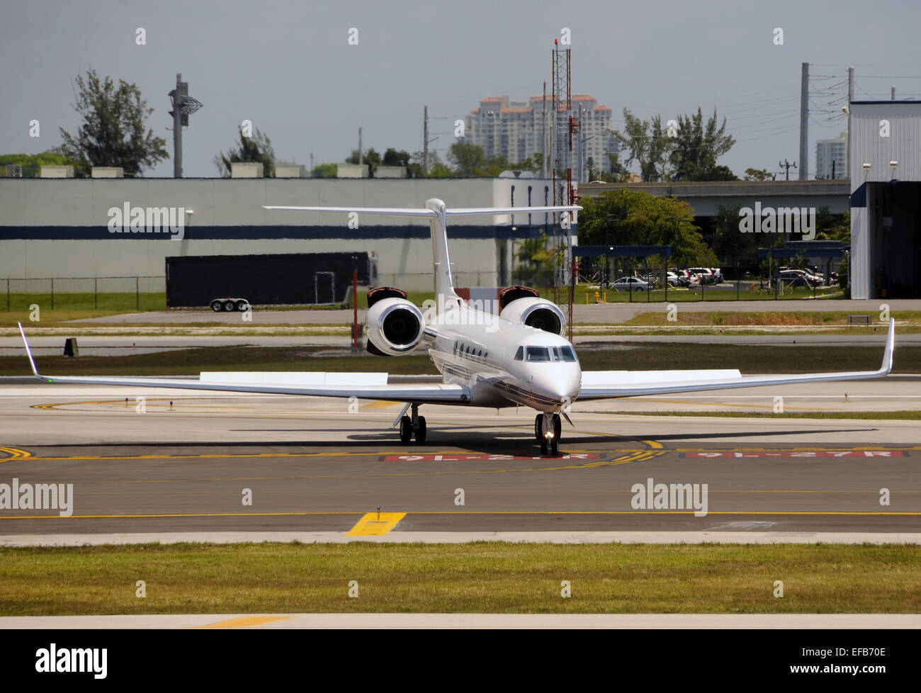 Luxury private jet taxiing on a tarmac Stock Photo - Alamy