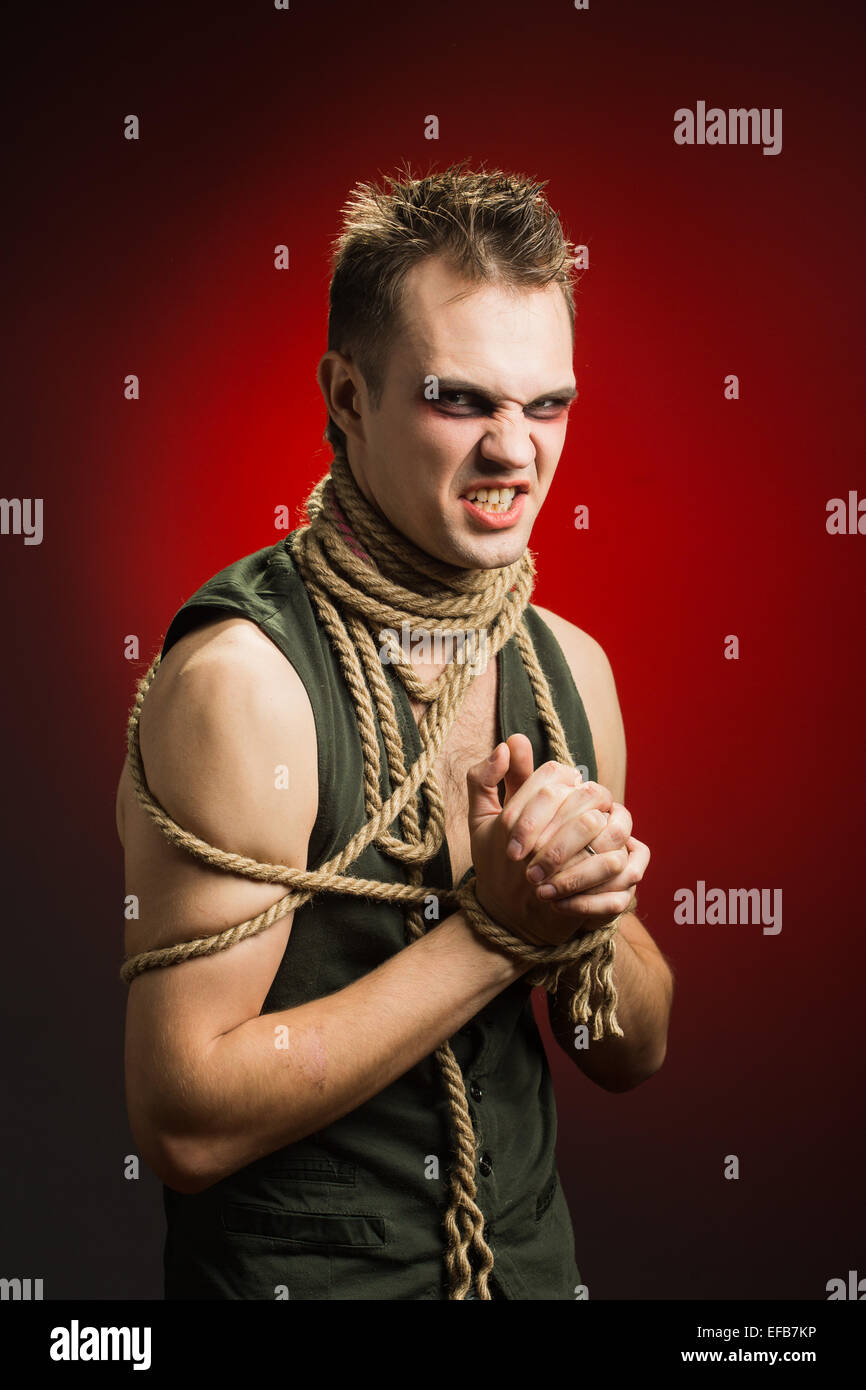angry man with a rope around his neck Stock Photo - Alamy