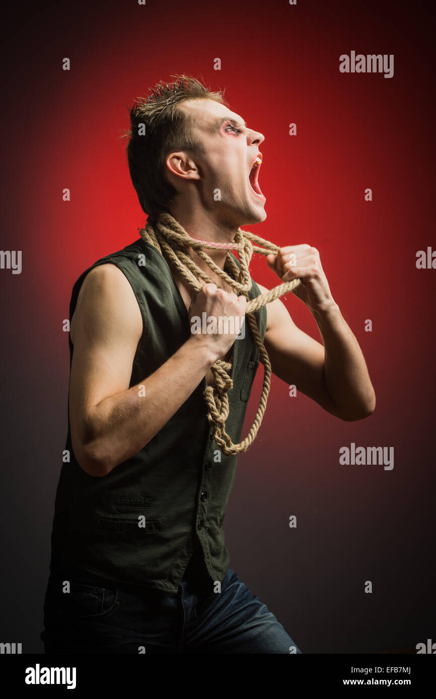 angry man with a rope around his neck Stock Photo - Alamy
