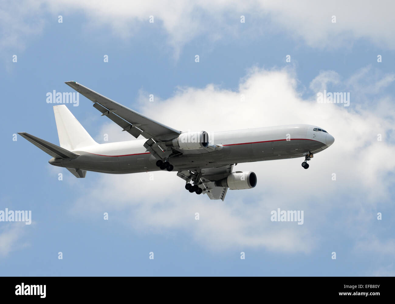 Modern jet airplane carrying cargo worldwide Stock Photo - Alamy