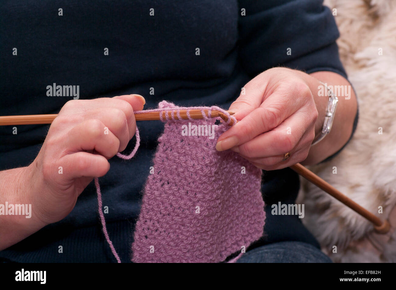 Womans Hands Knitting With Knitting Needles and Wool Stock Photo - Alamy