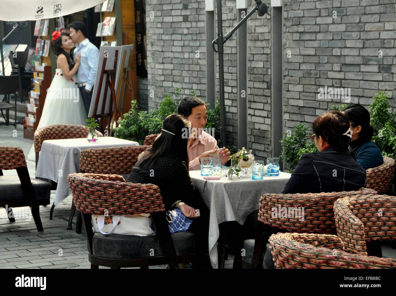 Chengdu, China: People drinking tea at an outdoor restaurant with young ...