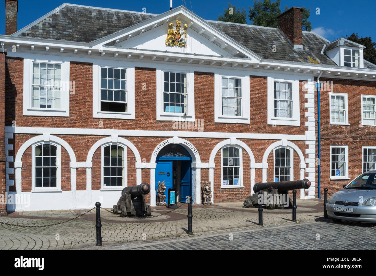 Customs House at Exeter Quays Exeter South Devon with a canon either ...