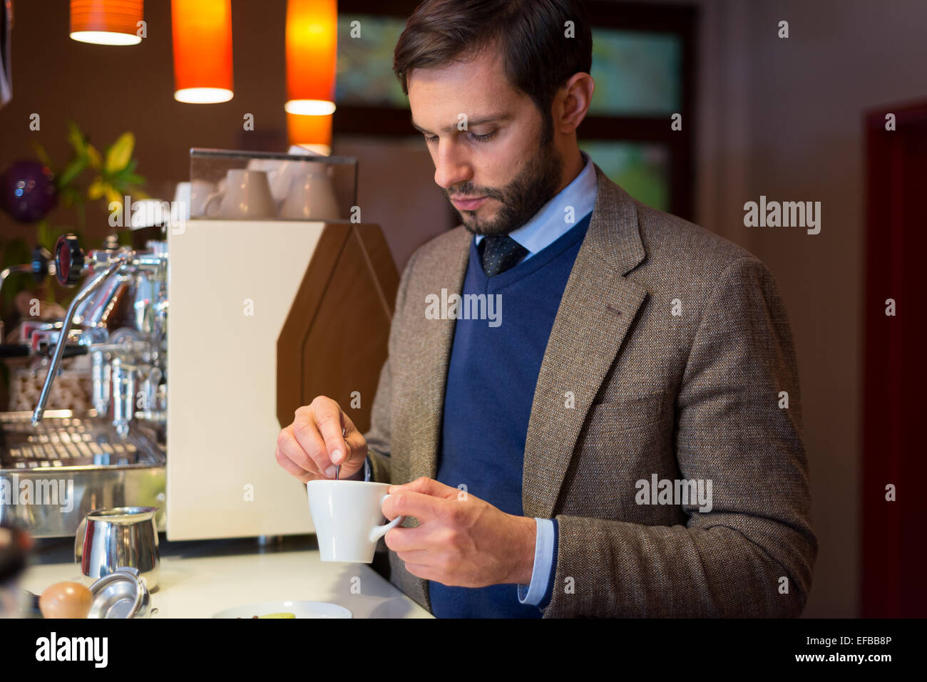 Business man in coffee shop, drinking espresso Stock Photo - Alamy