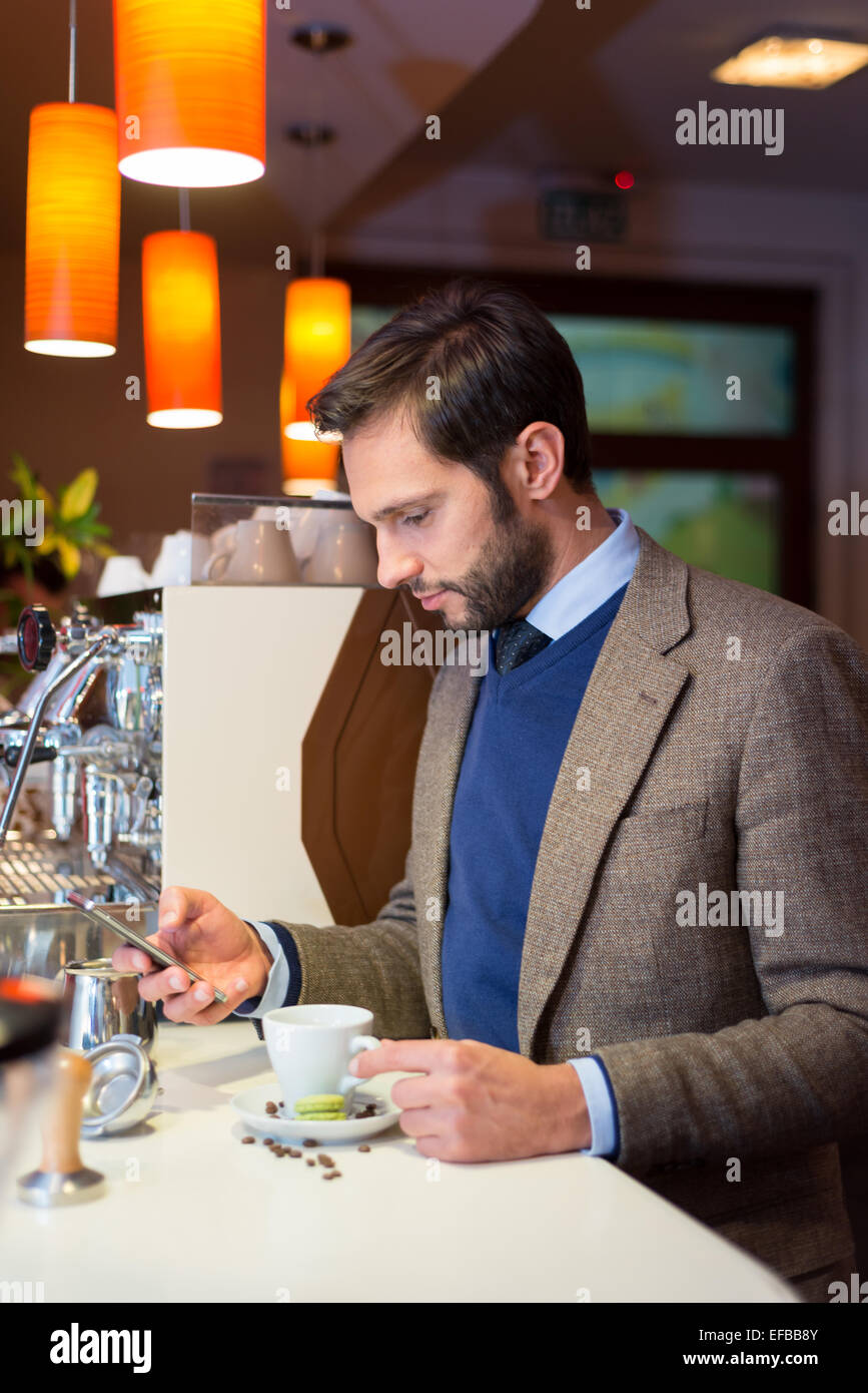 Business man in coffee shop, drinking espresso Stock Photo - Alamy