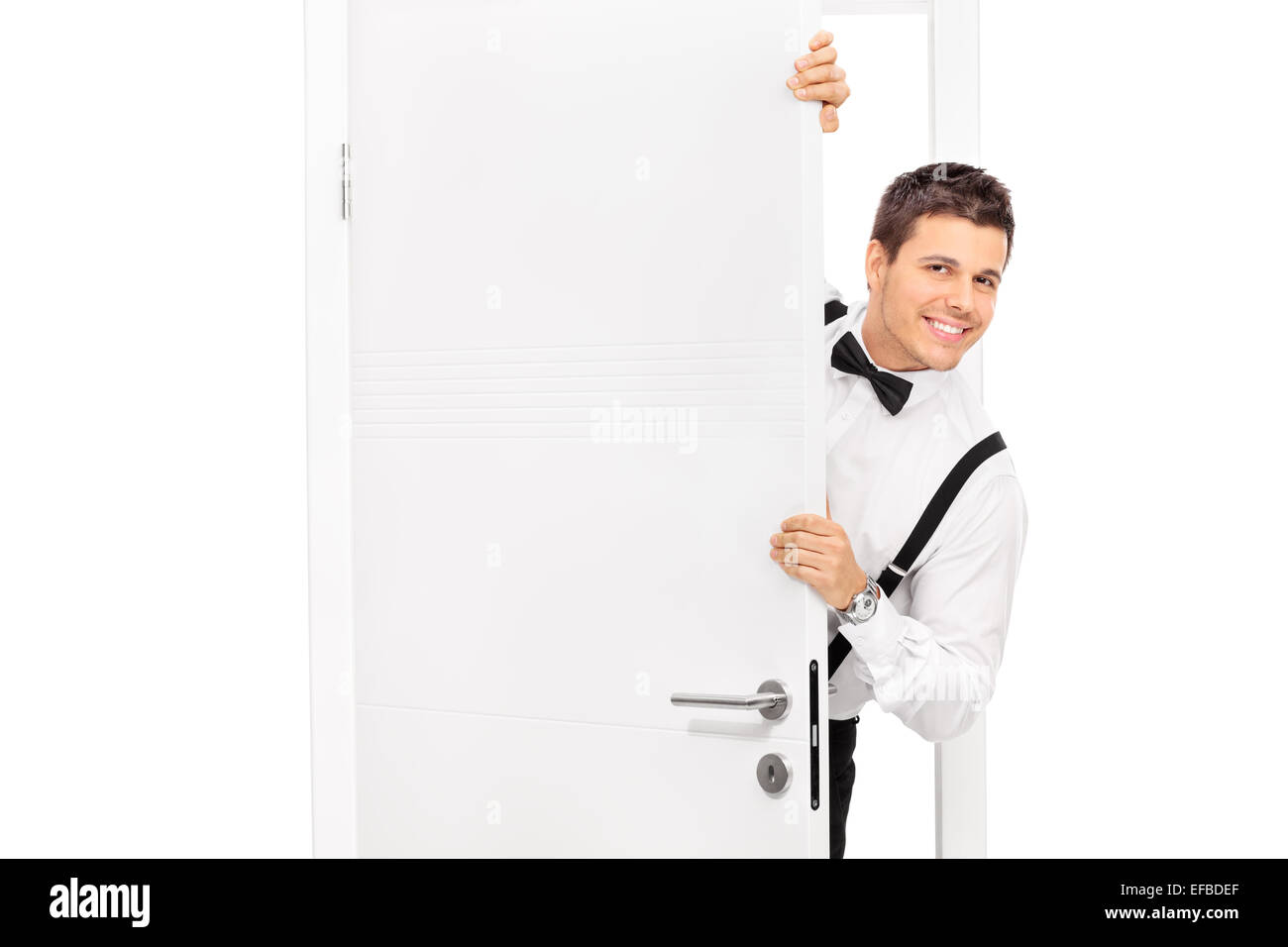 Man peeking door hi-res stock photography and images - Alamy