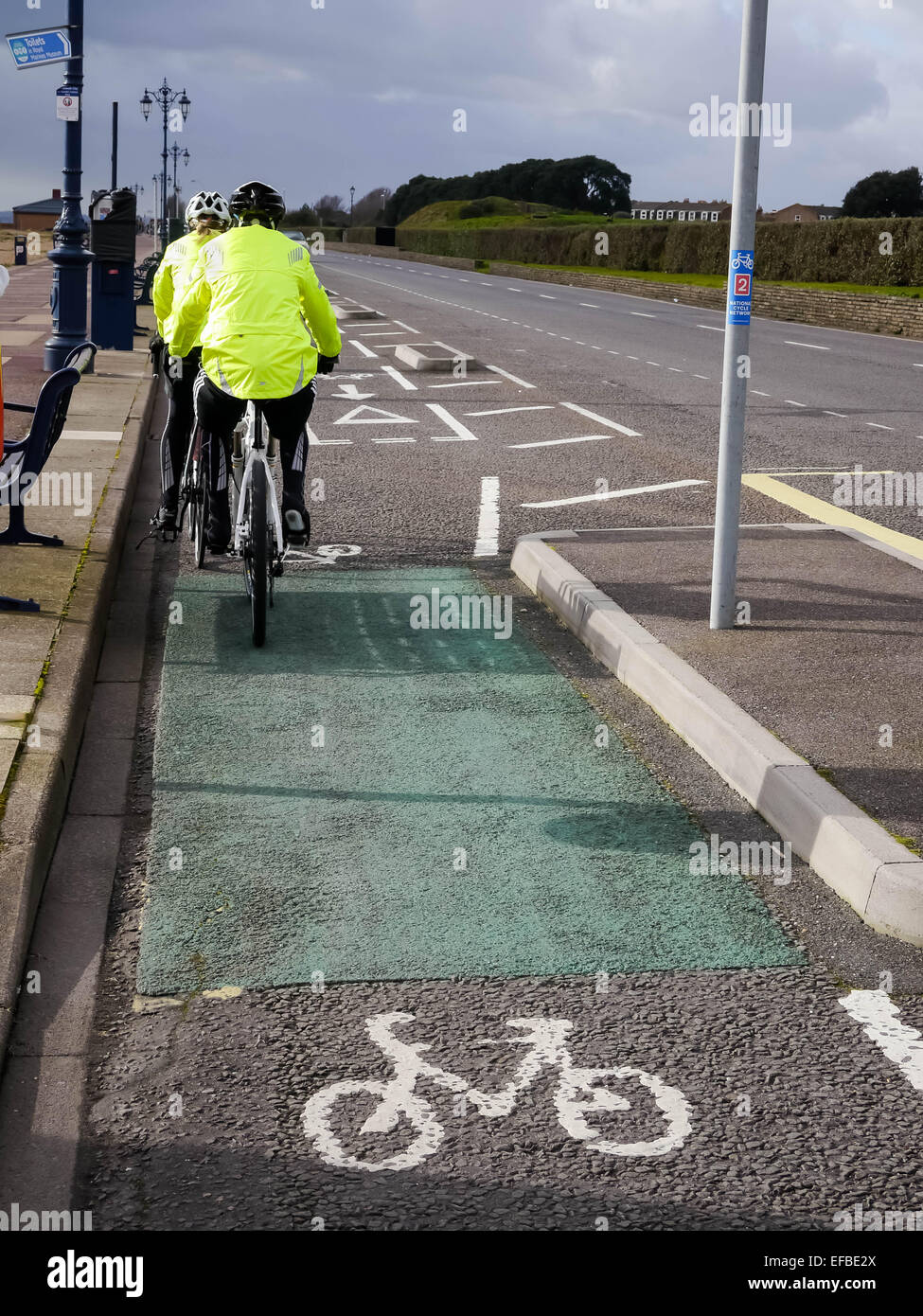 cyclists ride along a cycle path in Portsmouth, Hampshire, England ...